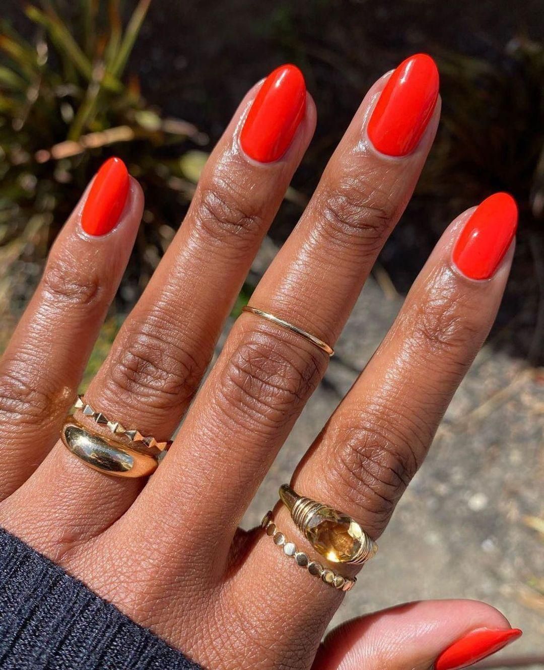 Simple and Classy: Classic Short Red Nails for Dark Skinned Women